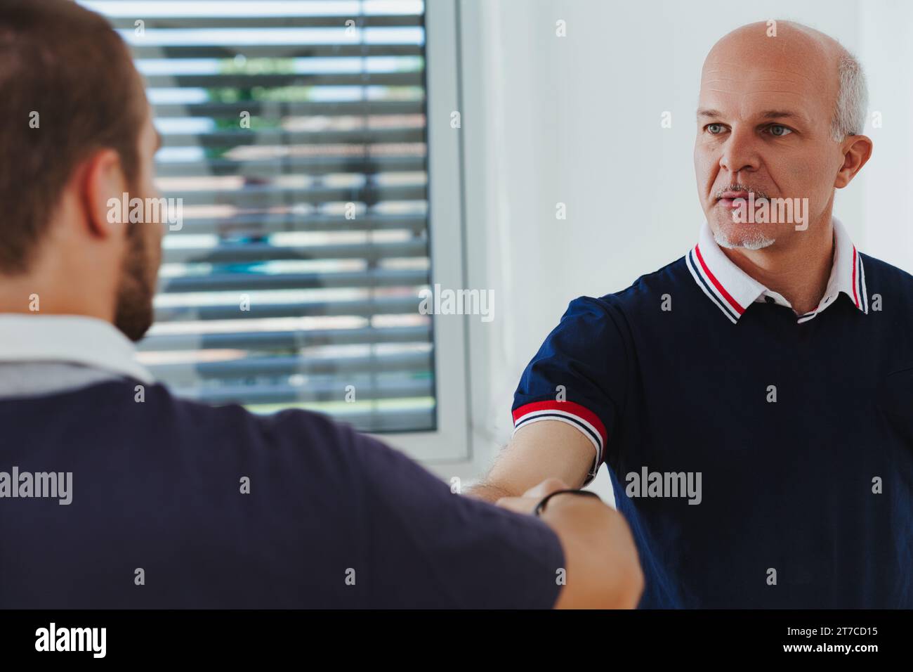 Aged person attentively engages, expression showing deep thought Stock ...