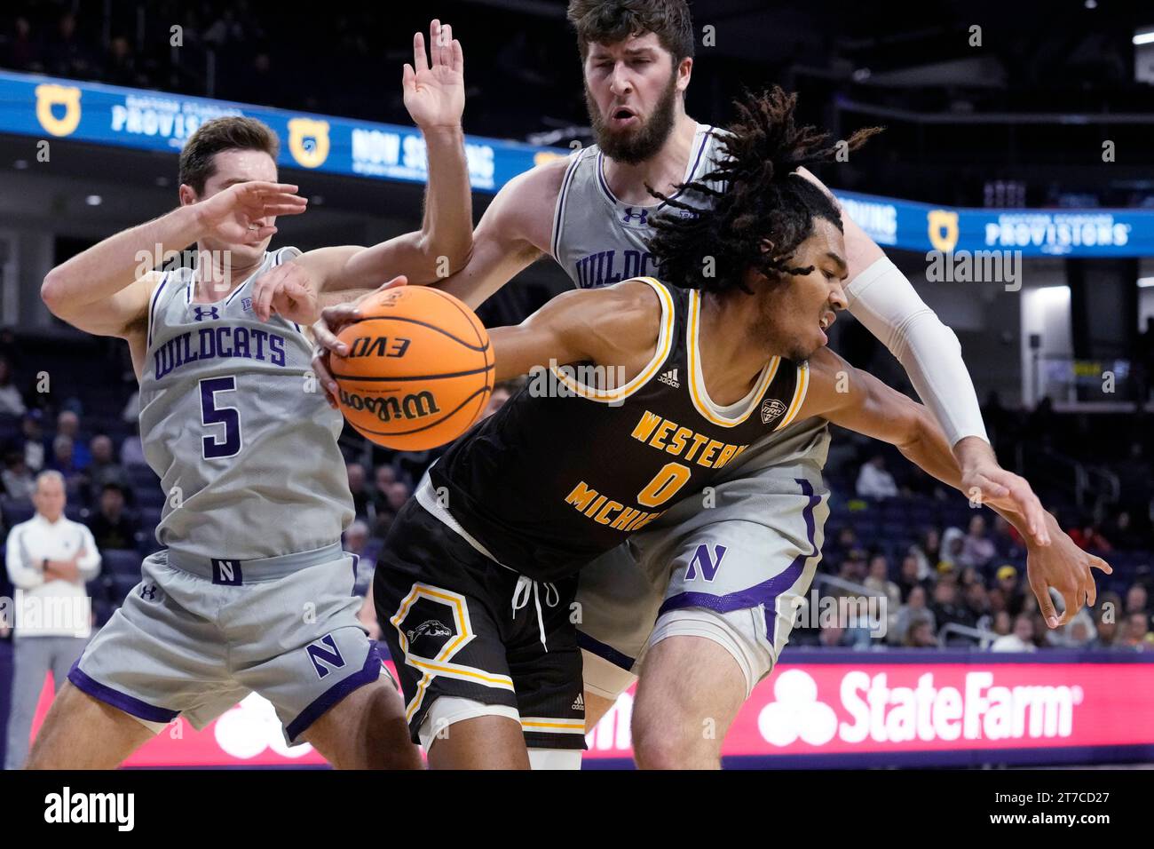 Western Michigan forward Anthony Crump (0) drives as Northwestern guard ...