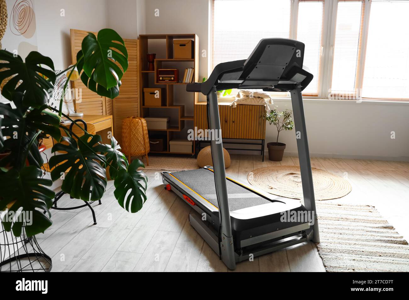 Modern treadmill in interior of modern room Stock Photo - Alamy