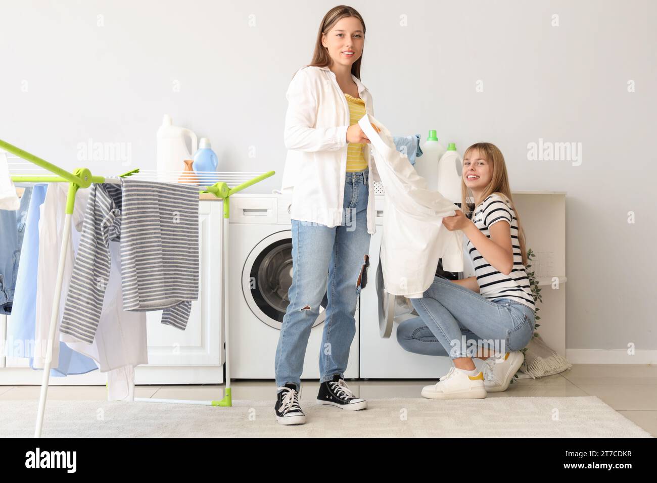 Female students doing laundry in dormitory Stock Photo - Alamy