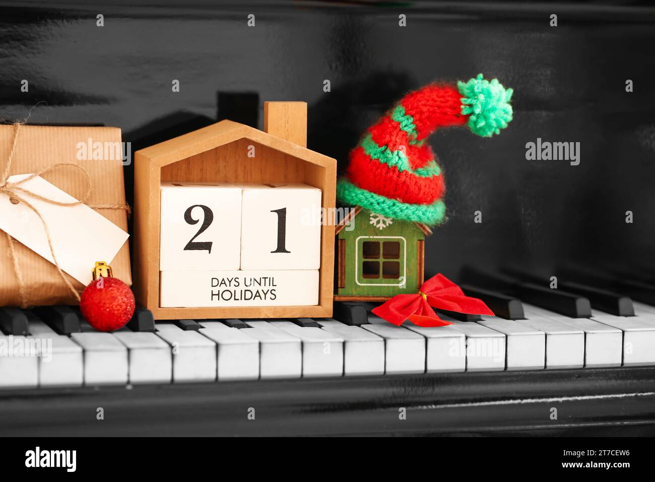 Calendar with text 21 DAYS UNTIL HOLIDAYS, Christmas gift and ...