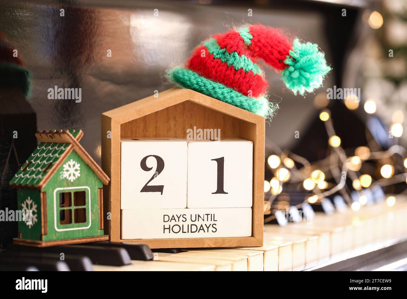 Calendar with text 21 DAYS UNTIL HOLIDAYS and Christmas decorations on ...