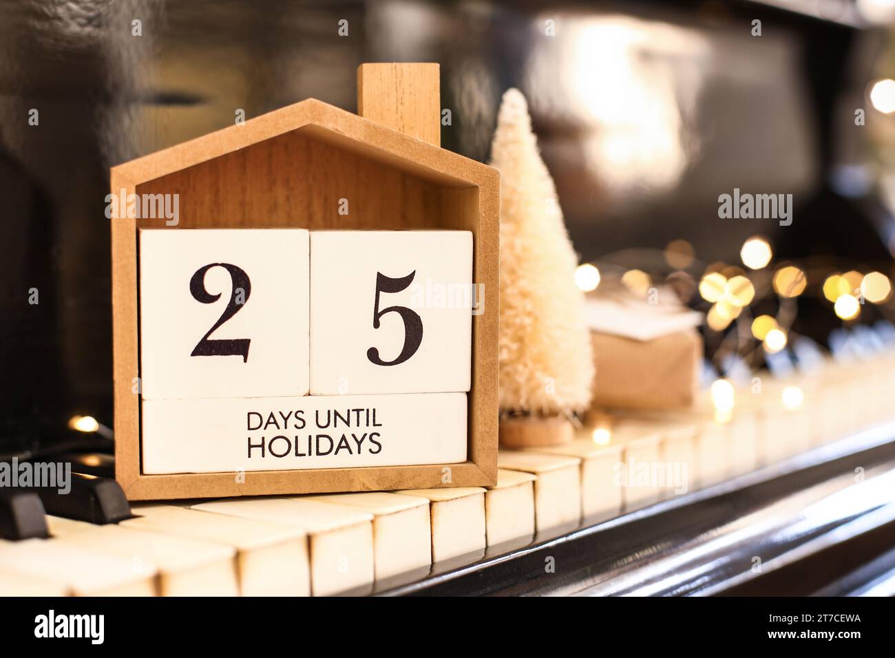 Calendar with text 25 DAYS UNTIL HOLIDAYS and Christmas decorations on ...