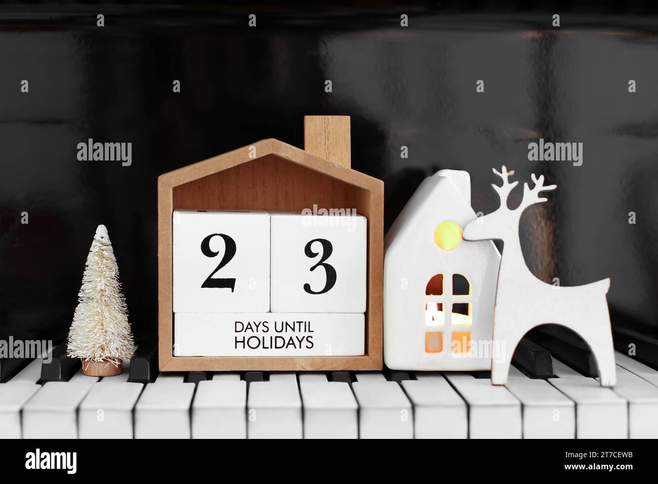 Calendar with text 23 DAYS UNTIL HOLIDAYS and Christmas decorations on ...