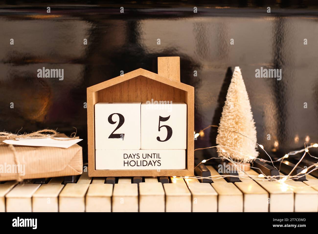 Calendar with text 25 DAYS UNTIL HOLIDAYS, Christmas decorations and ...