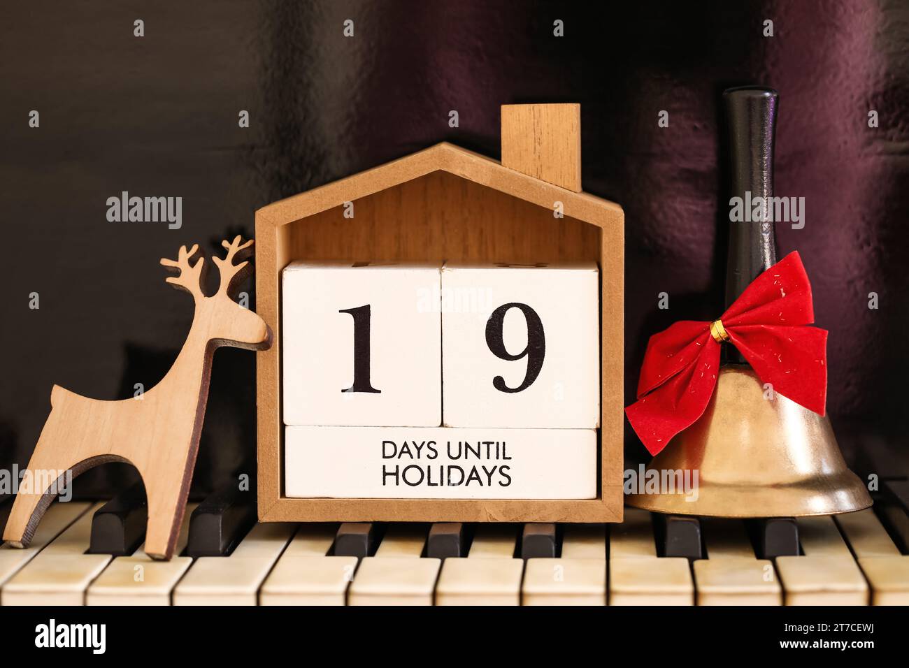 Calendar with text 19 DAYS UNTIL HOLIDAYS and Christmas decorations on ...