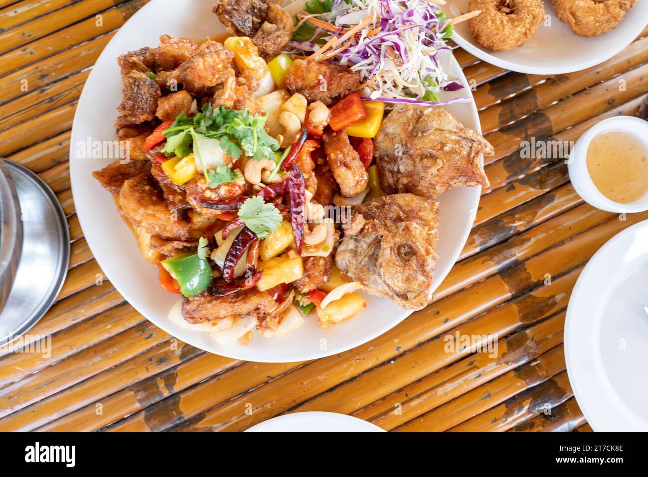 Pla Sam Ros, a simple fried fish dish. topped with chili garlic It's ...