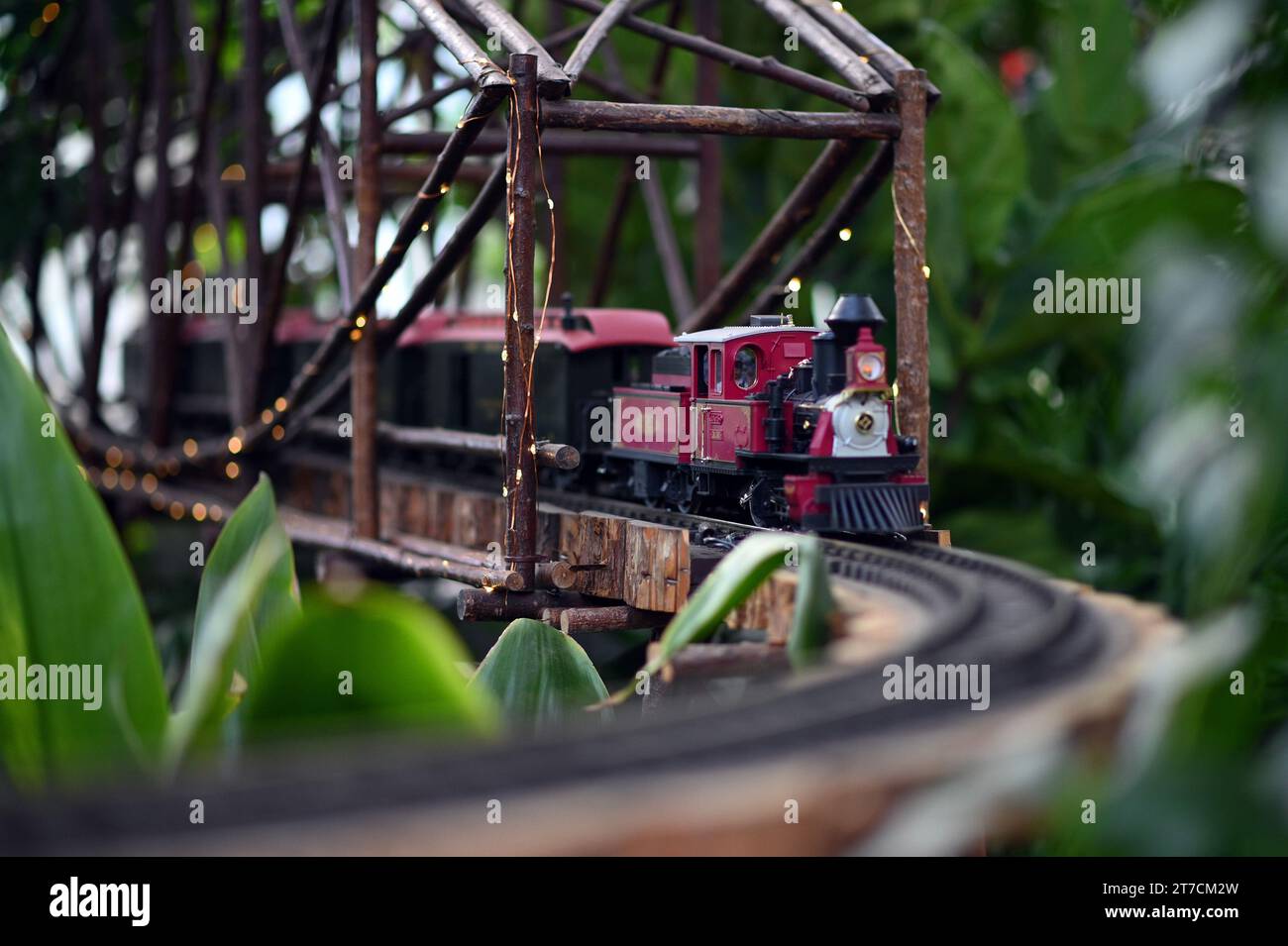 New York, USA. 14th Nov, 2023. Model electric trains run through ...