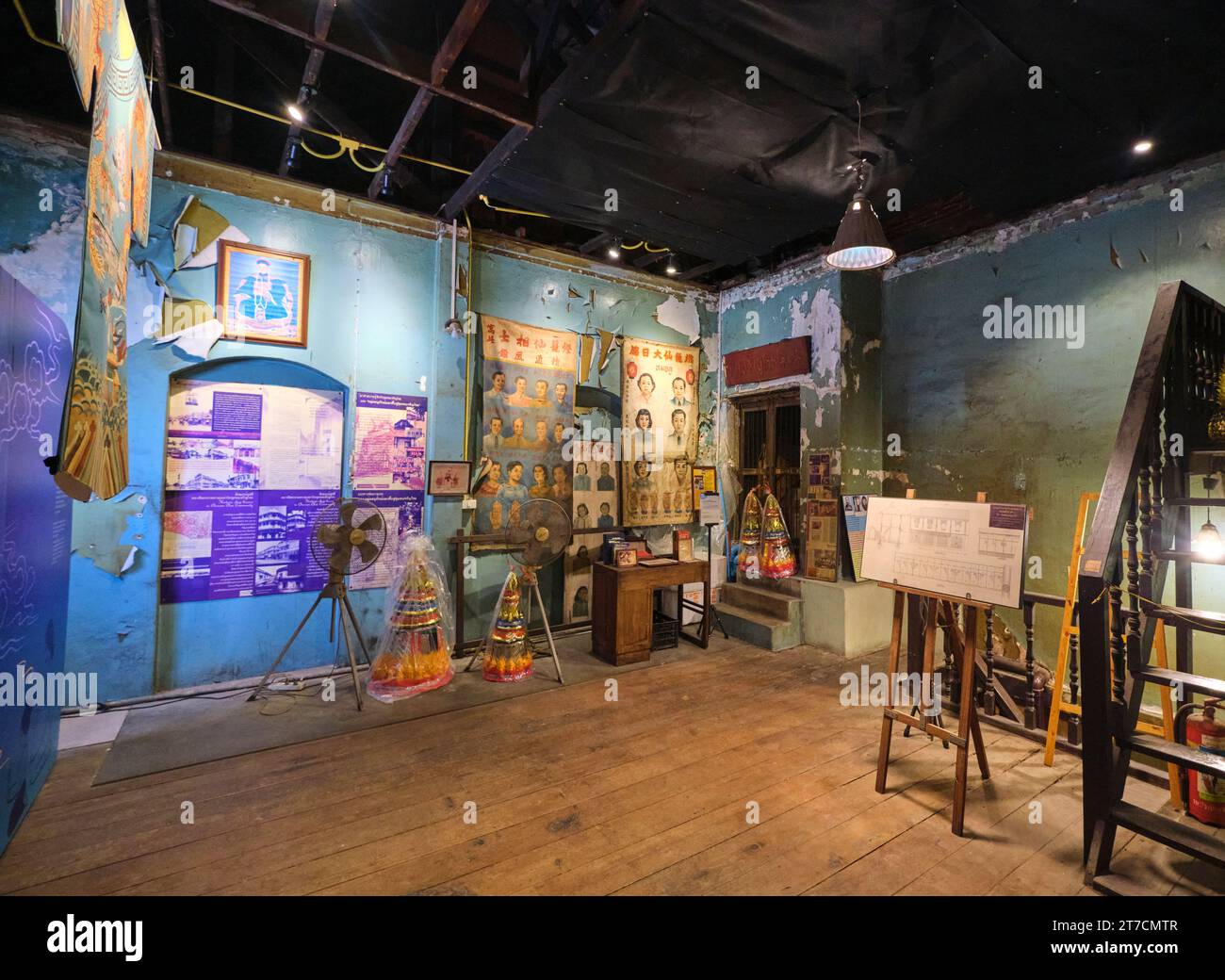 One of the display areas, with old posters and religious offerings. At ...