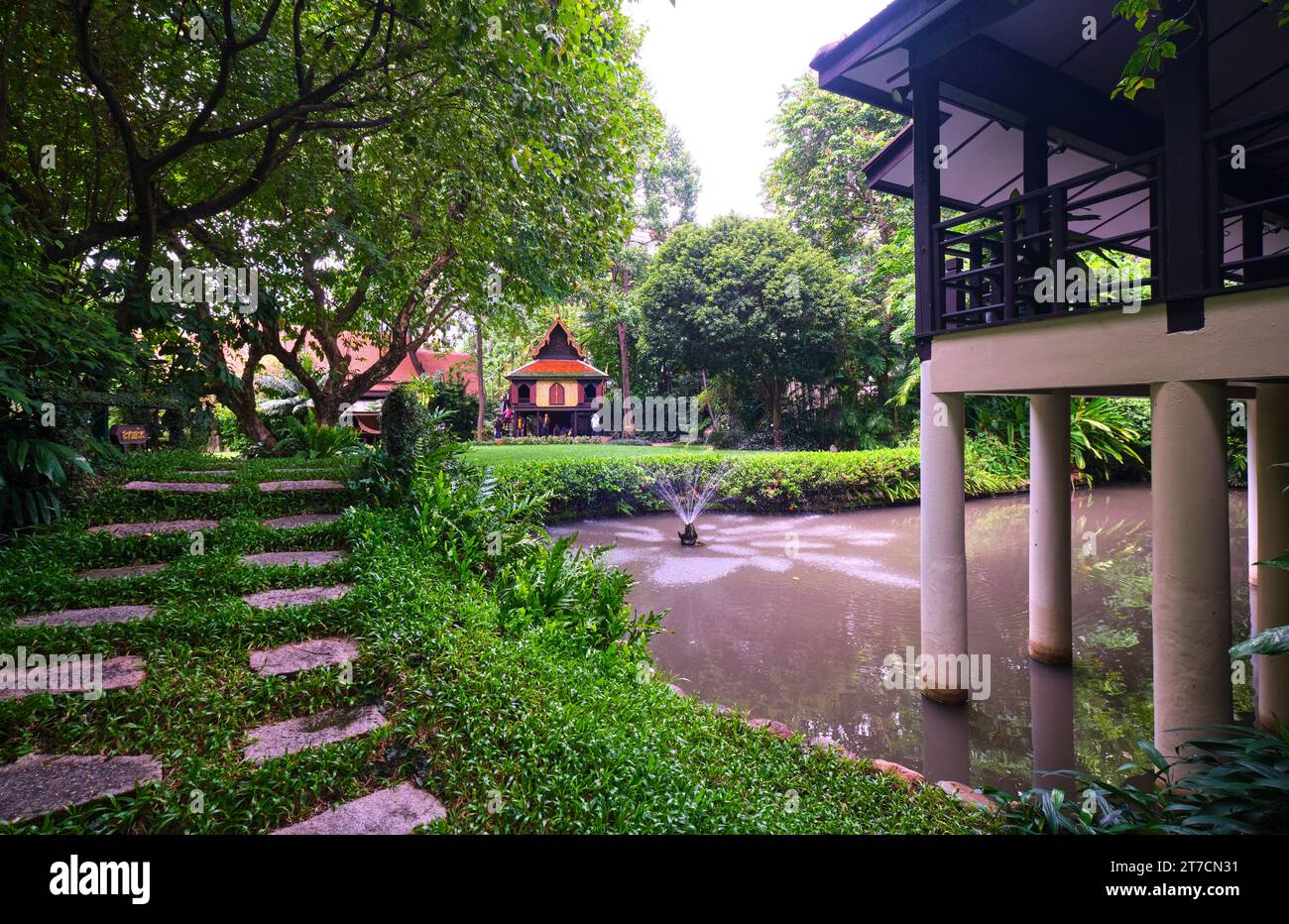 A view of the property, houses spread around a pond and grass, lawns. At the Suan Pakkad Palace ...