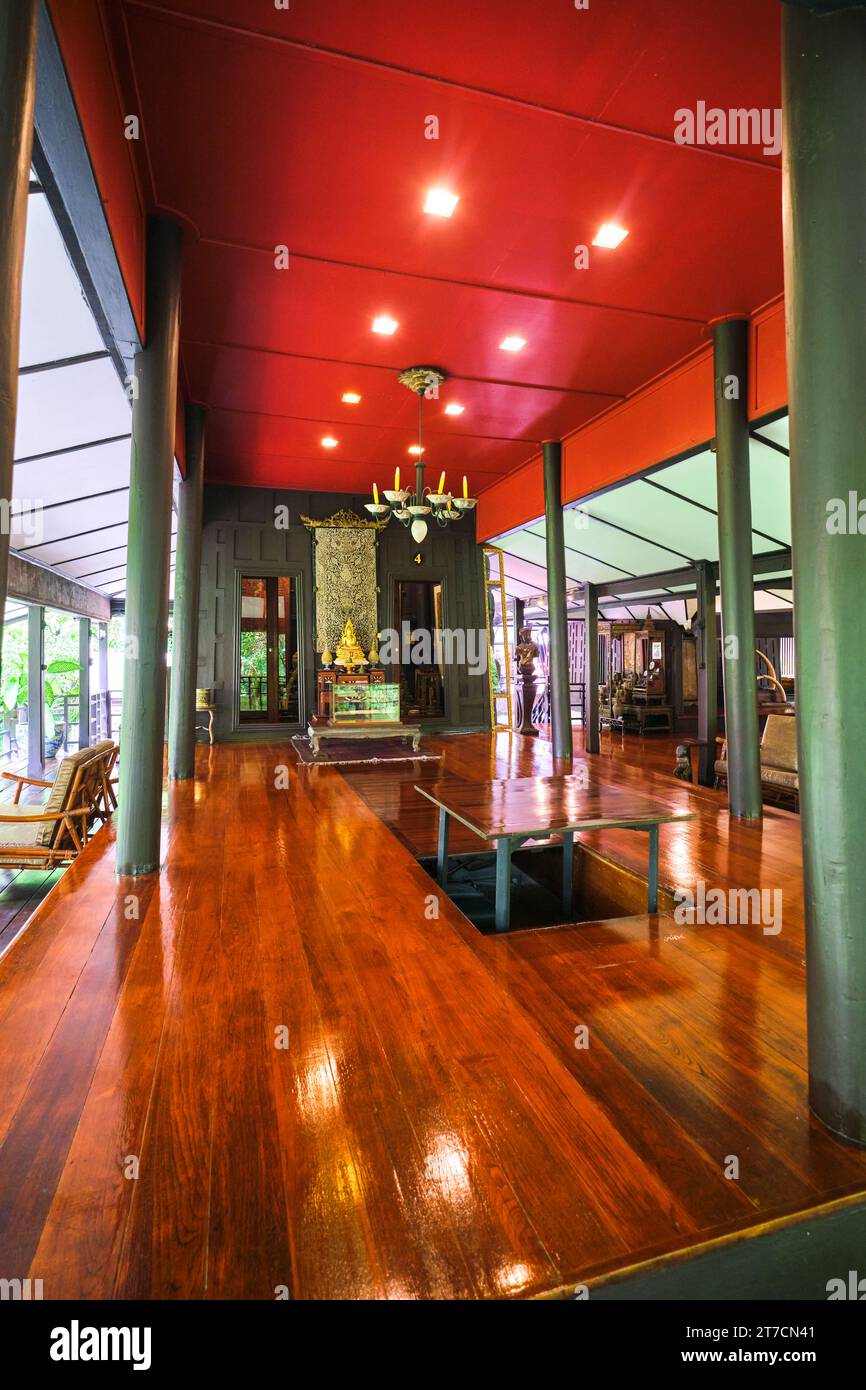 A fancy gold Buddha statue inside a preserved house. At the Suan Pakkad ...