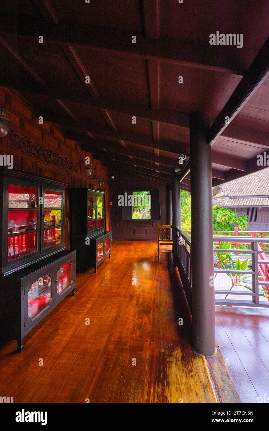 View of a wide, wood veranda with large overhang to protect from sun ...