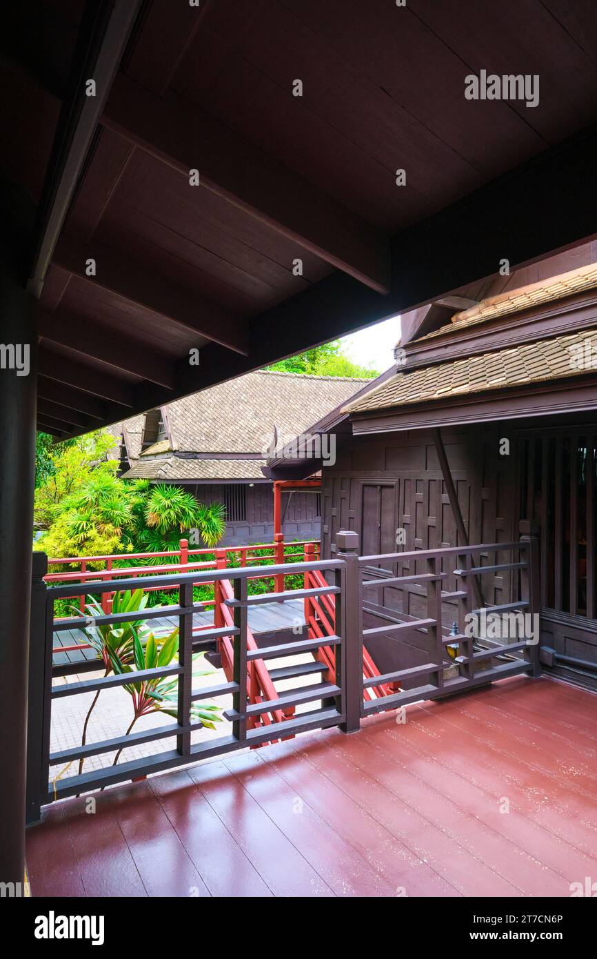 View of a wide, wood veranda with large overhang to protect from sun ...
