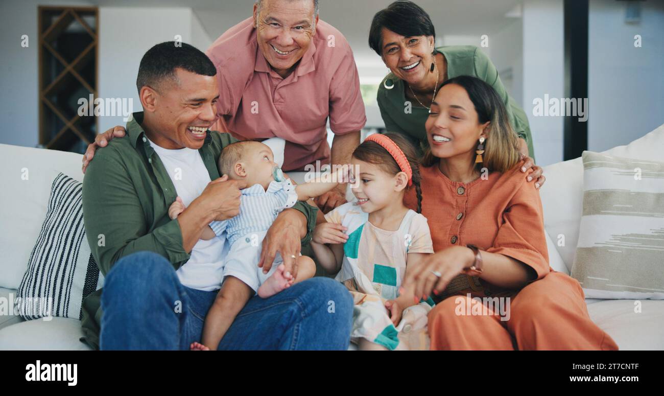 Happy, smile and big family playing on sofa in the living room at ...