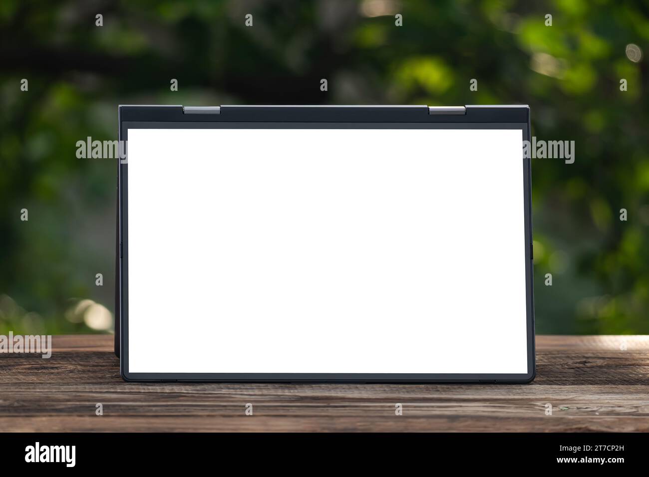 Mockup image of laptop with blank white screen on vintage wooden table ...