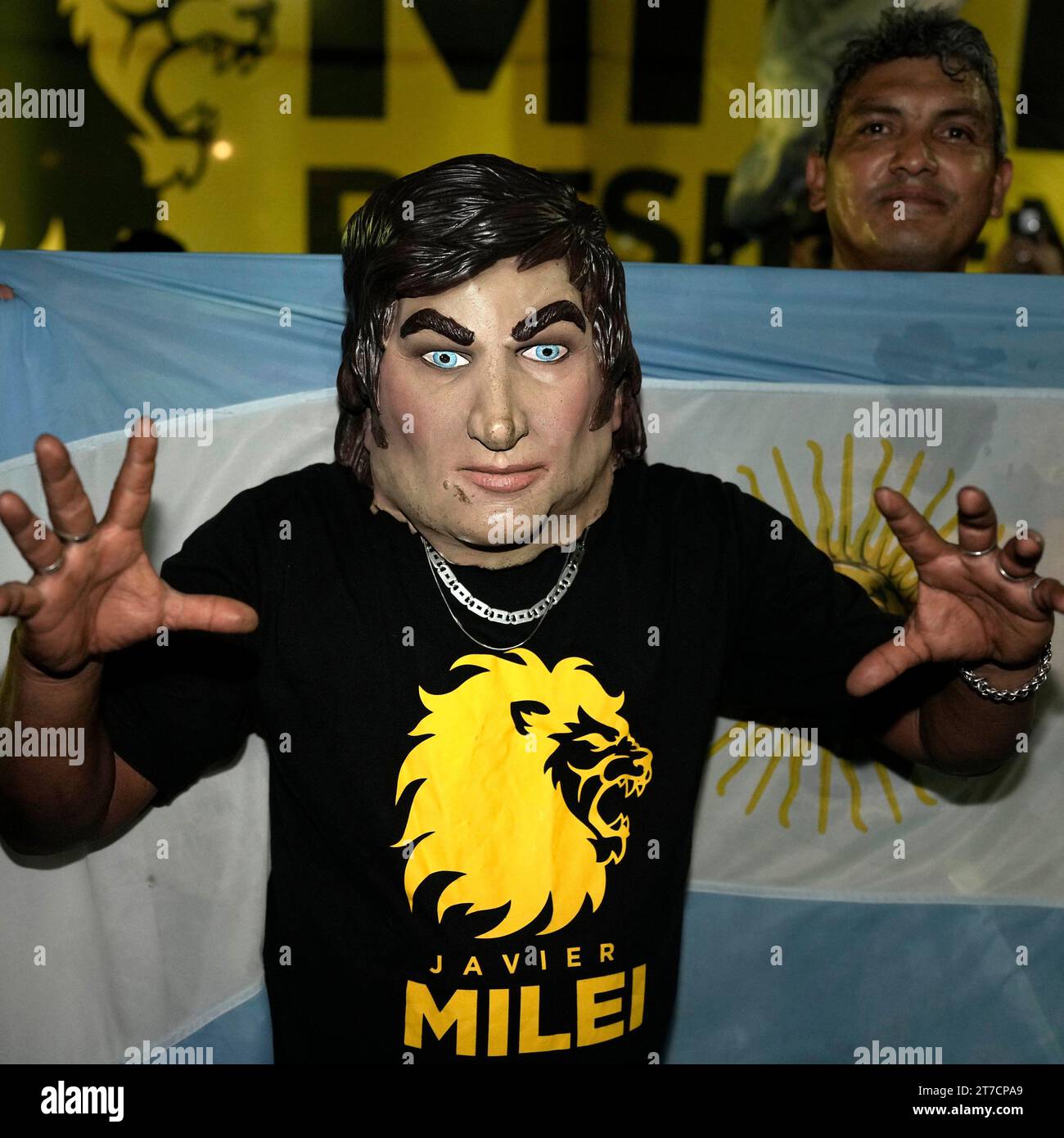 A supporter of presidential hopeful Javier Milei wears a Milei mask ...