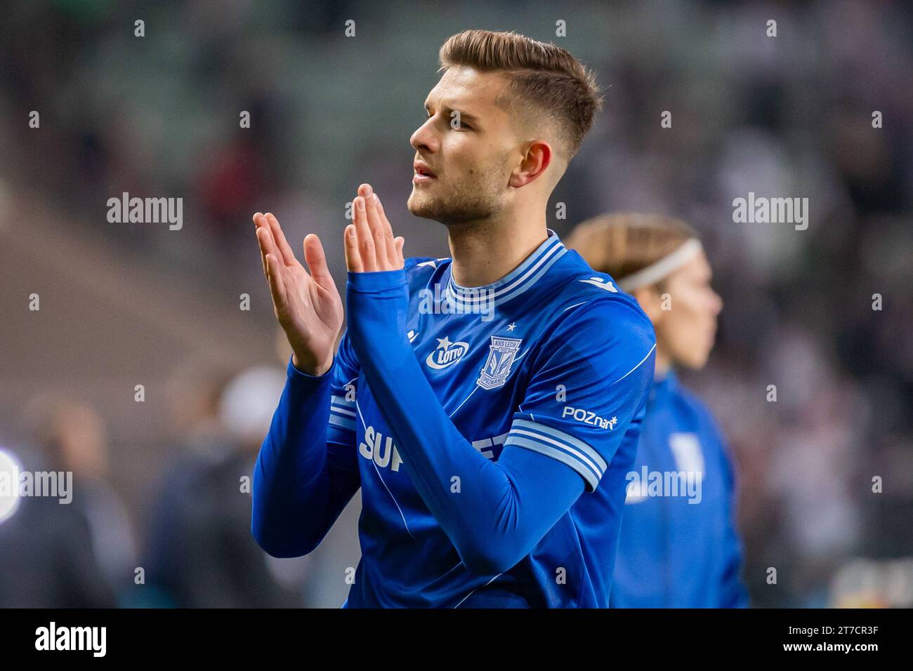Warsaw, Poland. 12th Nov, 2023. Filip Szymczak of Lech applauds during ...