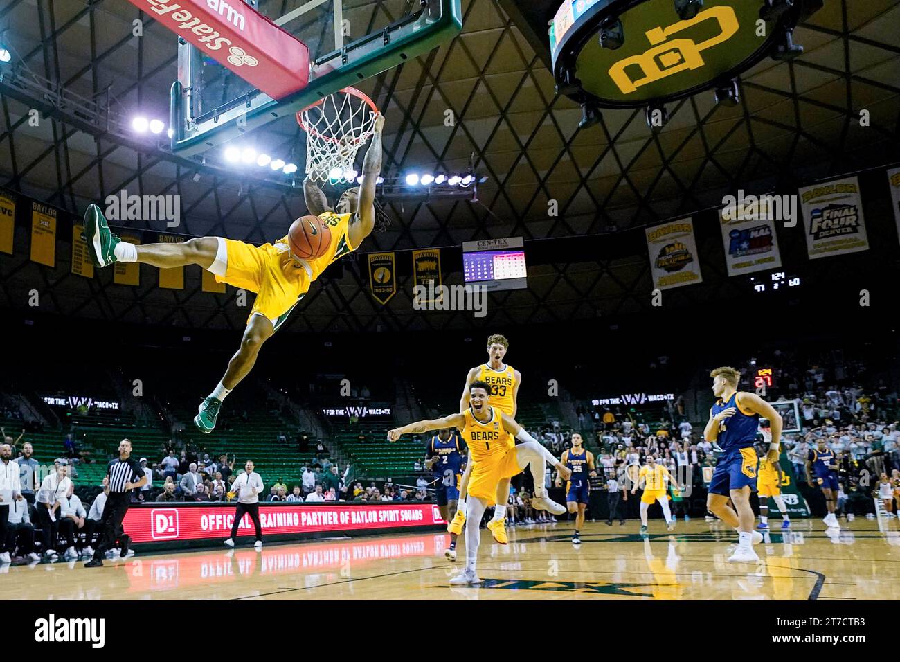 Baylor's Dantwan Grimes, left, dunks on UMKC as teammates Miro Little ...