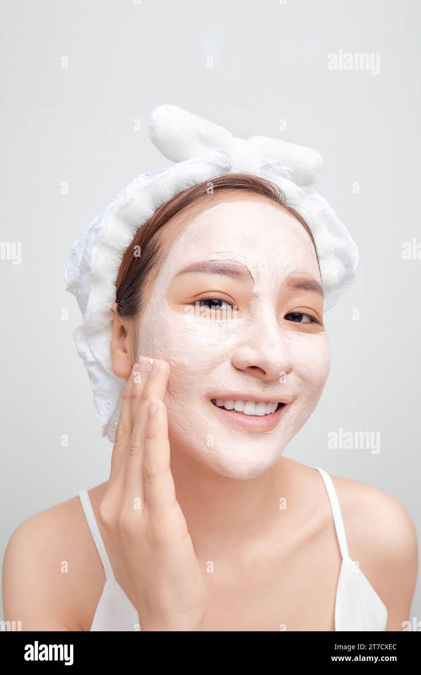 the woman after the shower put a mask on her face Stock Photo - Alamy