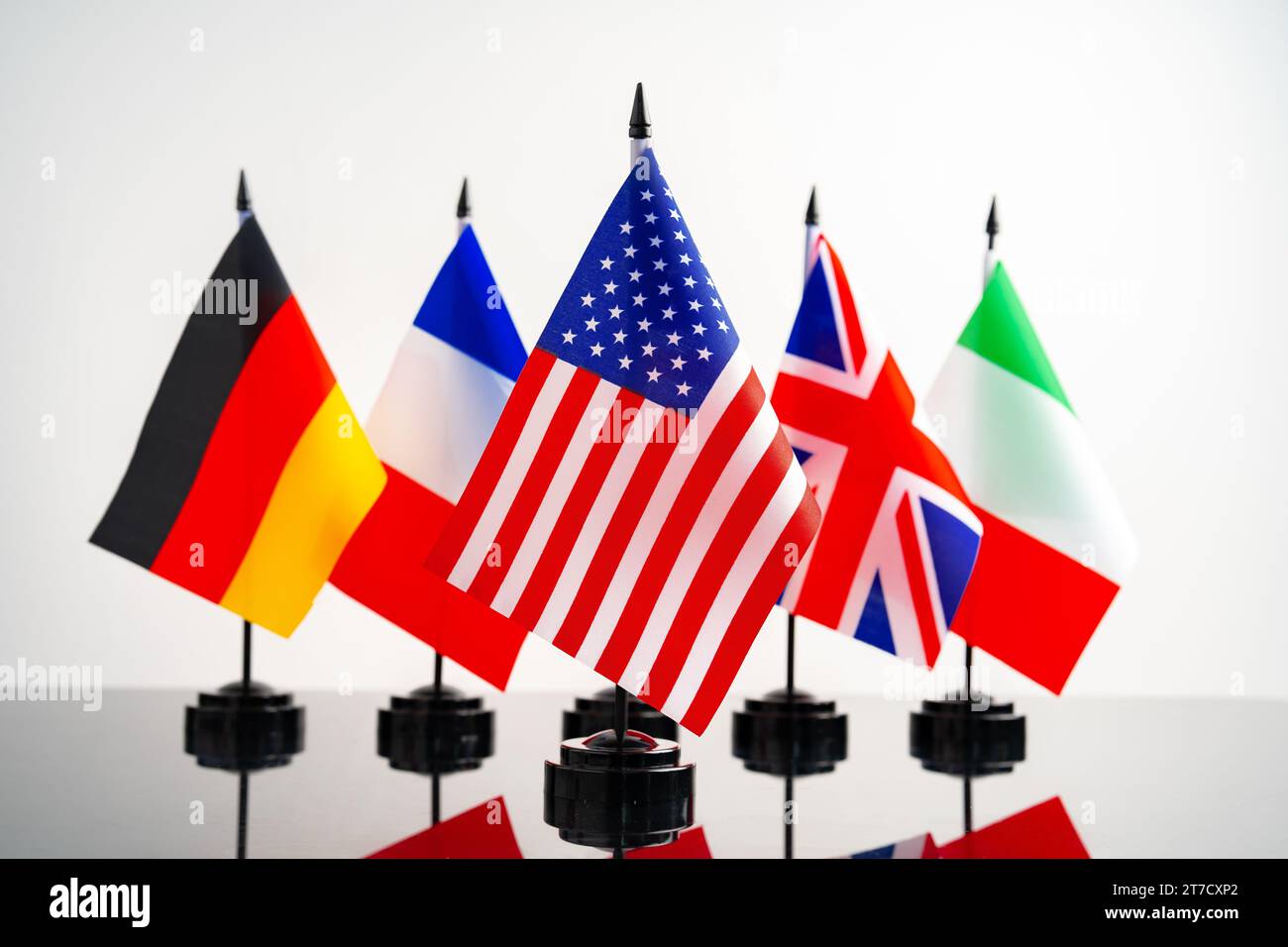 Lots of small national flags on table Stock Photo - Alamy