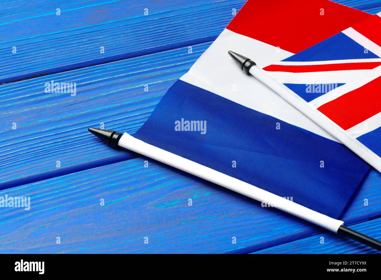 Flags of France and Great Britain on blue wooden background Stock Photo ...