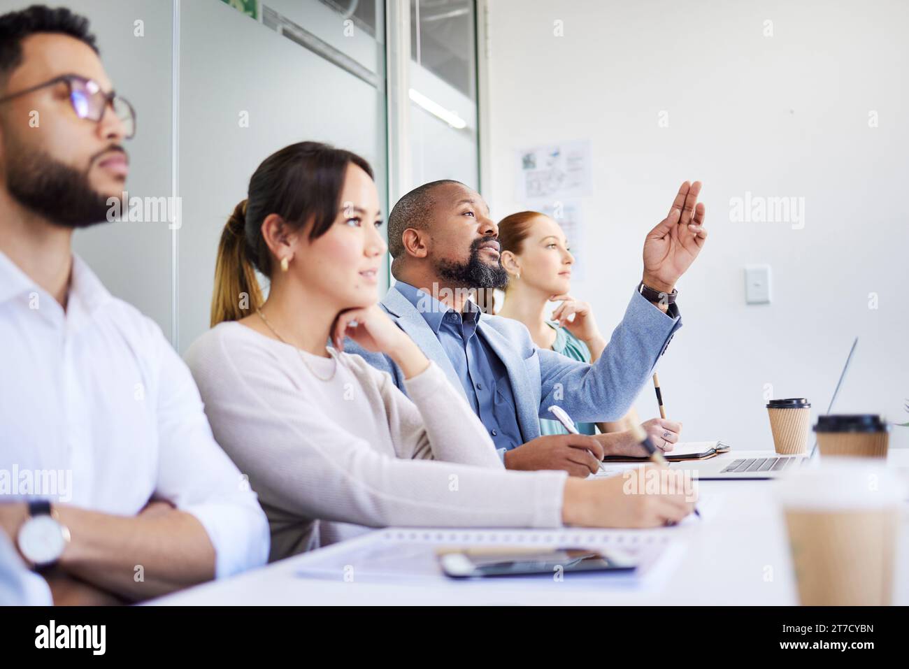 Seminar black man, business people and hand raised to ask questions about project, ideas or ...