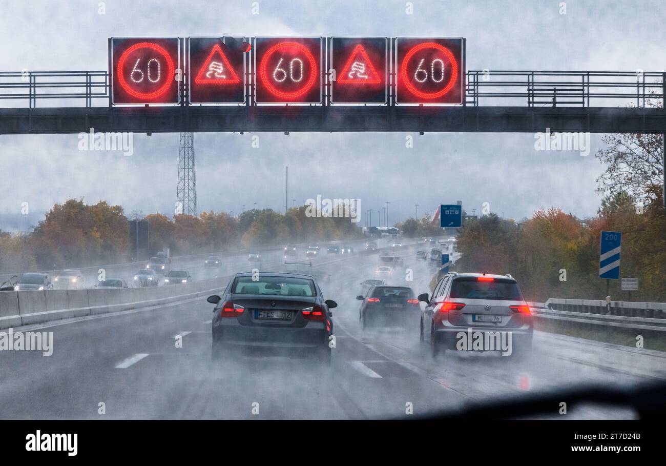 29 October 2023, Hesse, Ober-Mörlen: Cars driving at dusk in the rain ...
