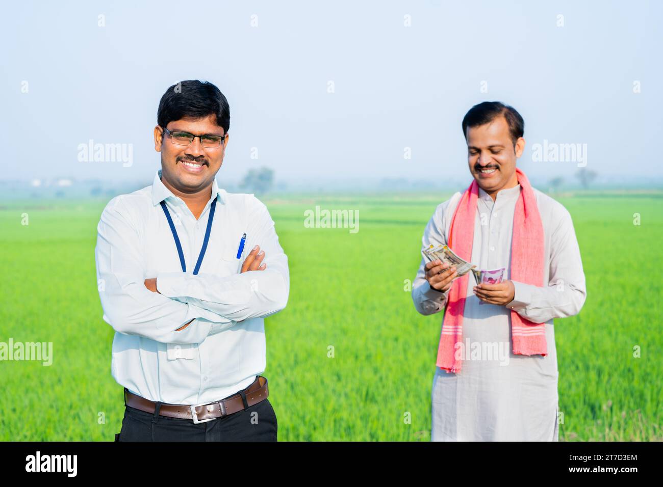 focus on banker, Happy indian banker standing with crossed arms in ...