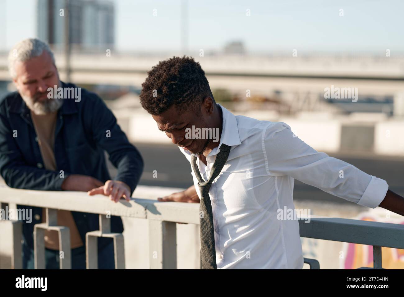 African American young man in trouble getting ready for jump while ...
