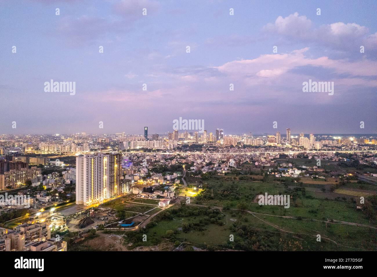 aerial drone shot showing under construction buildings with gurgaon ...
