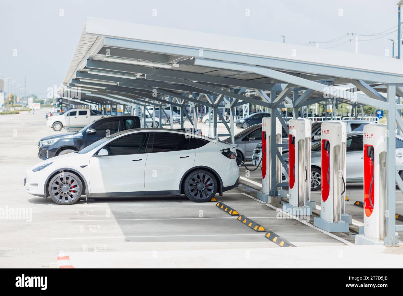 Tesla EV car charging at Tesla Supercharger 250 kW dock battery fast ...