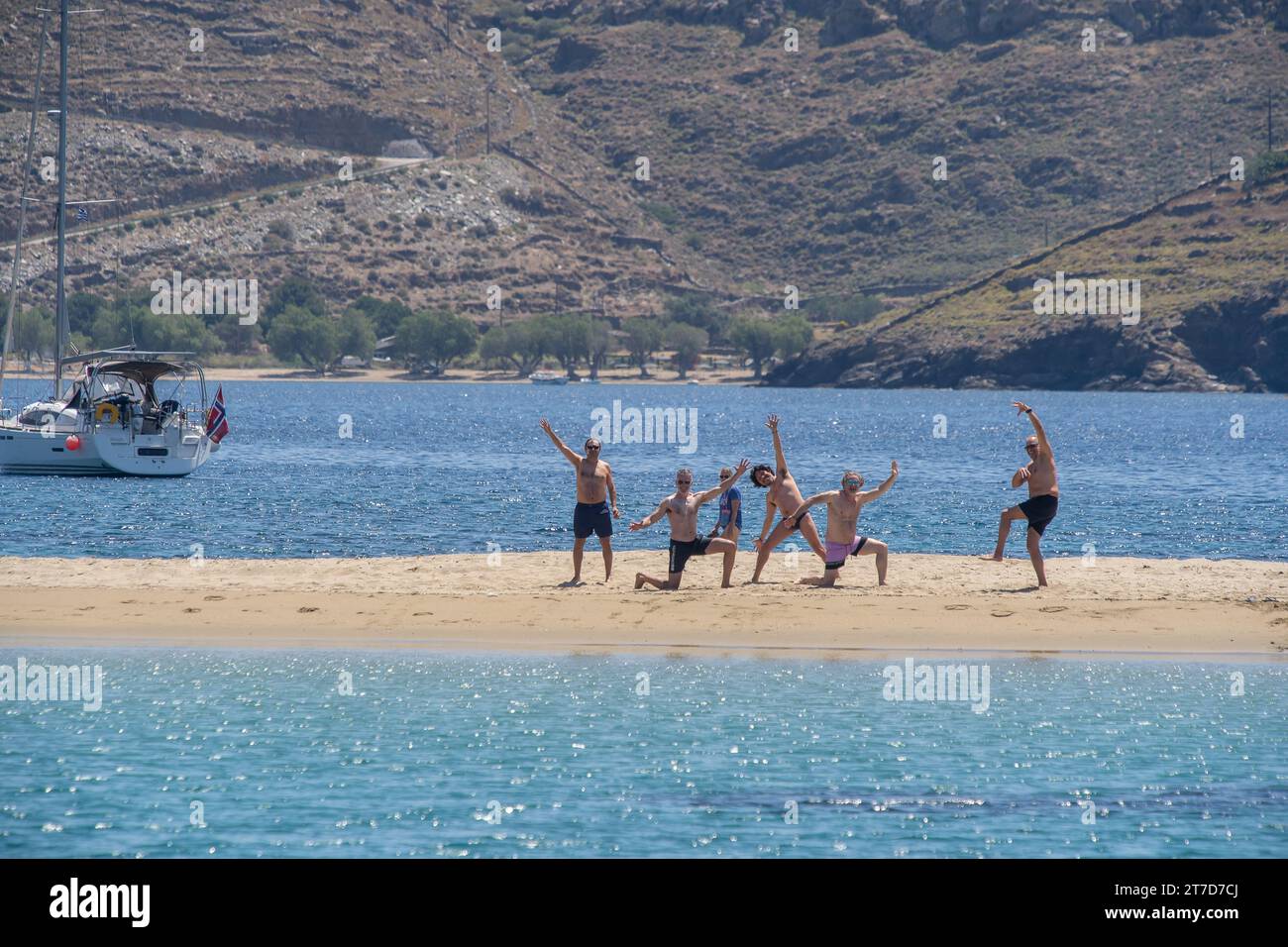 Group of middleaged friends making fun at Kolona, Kythnos, Greece Stock ...