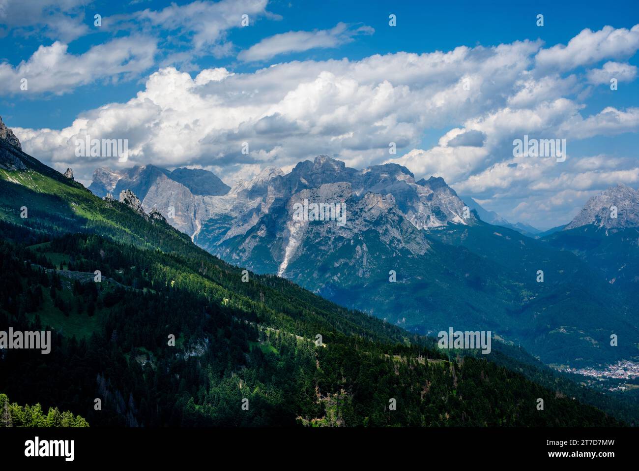 Dolomite mountains and Alps peaks with green meadows and rock spiers ...