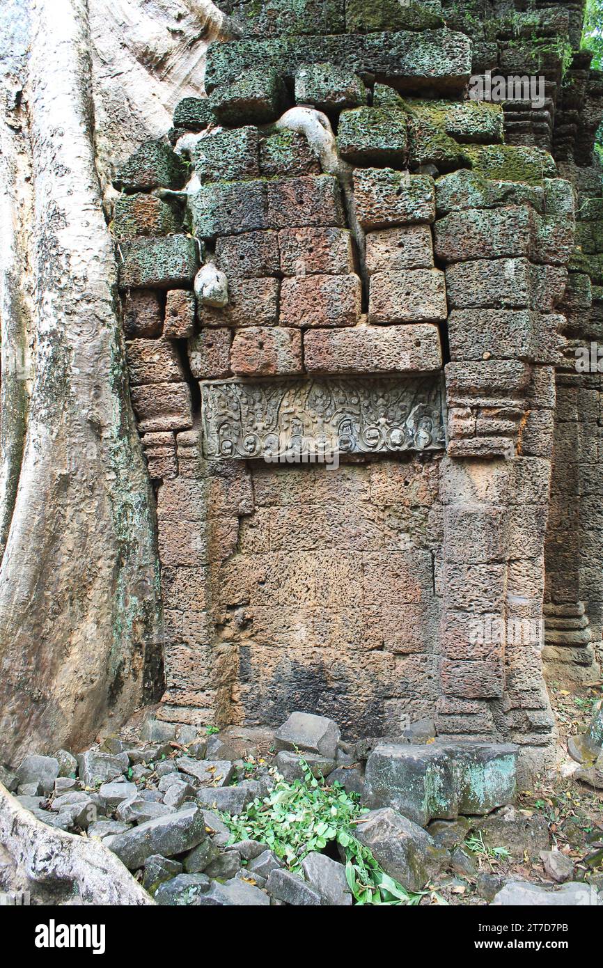Ancient Angkor temple ruin with exposed weathered laterite stone ...