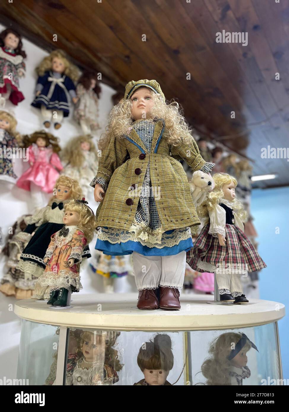 A vintage collection of dolls arranged in a tableau Stock Photo - Alamy