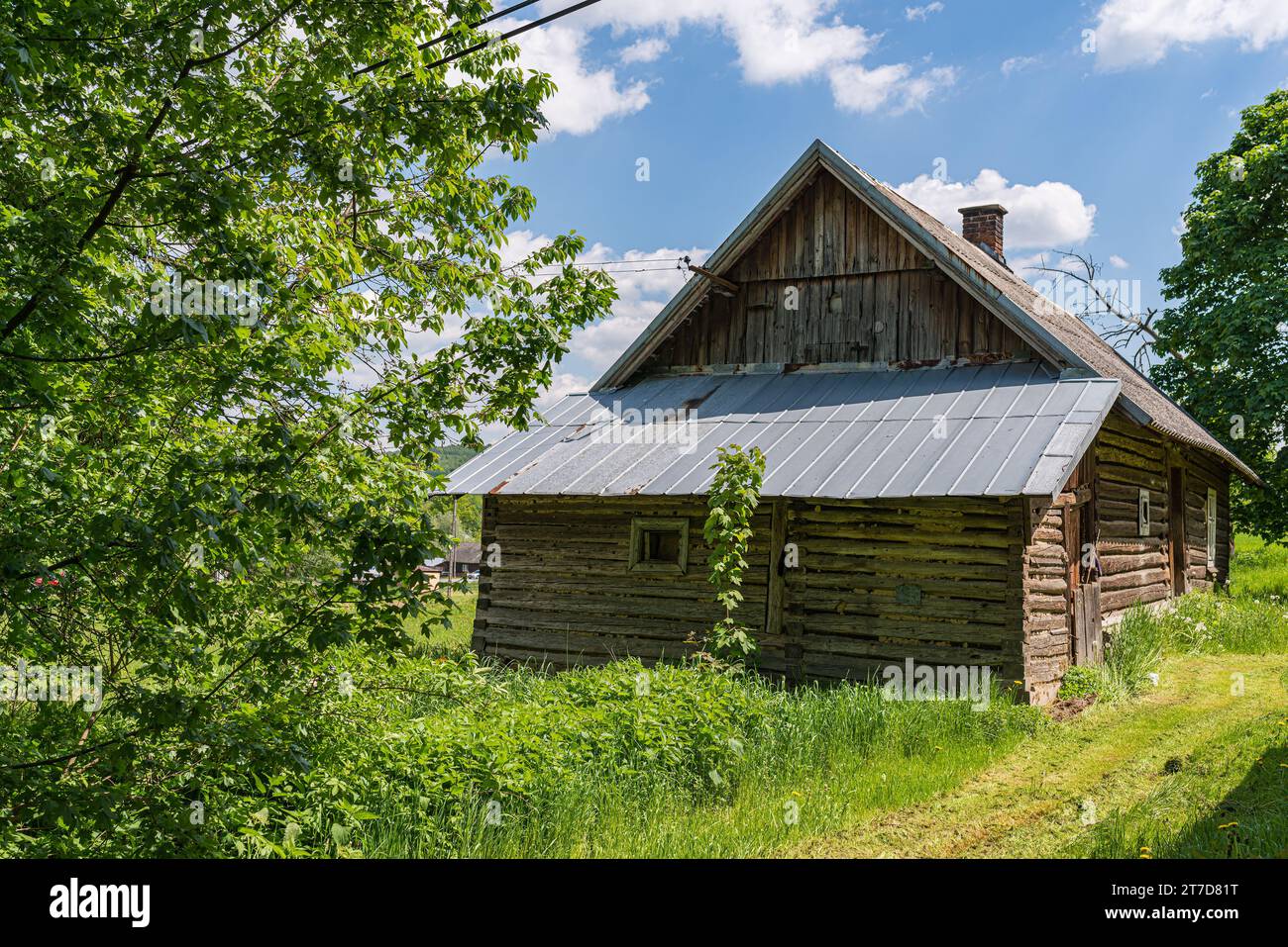 Old wooden house on grassy areas Stock Photo - Alamy