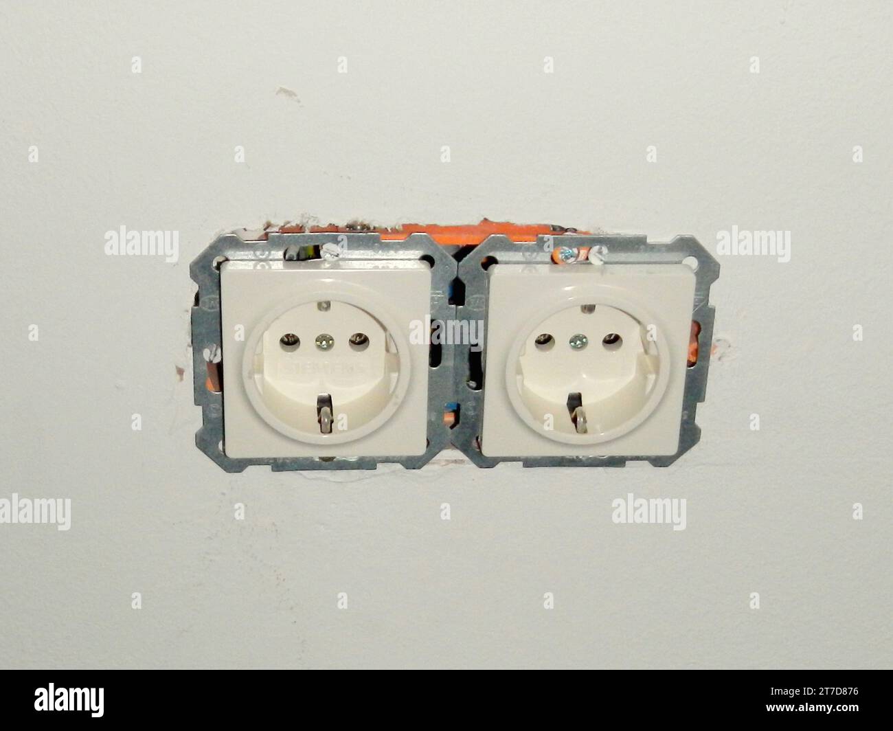 Detail of a construction site. Two power outlets in a drywall ...