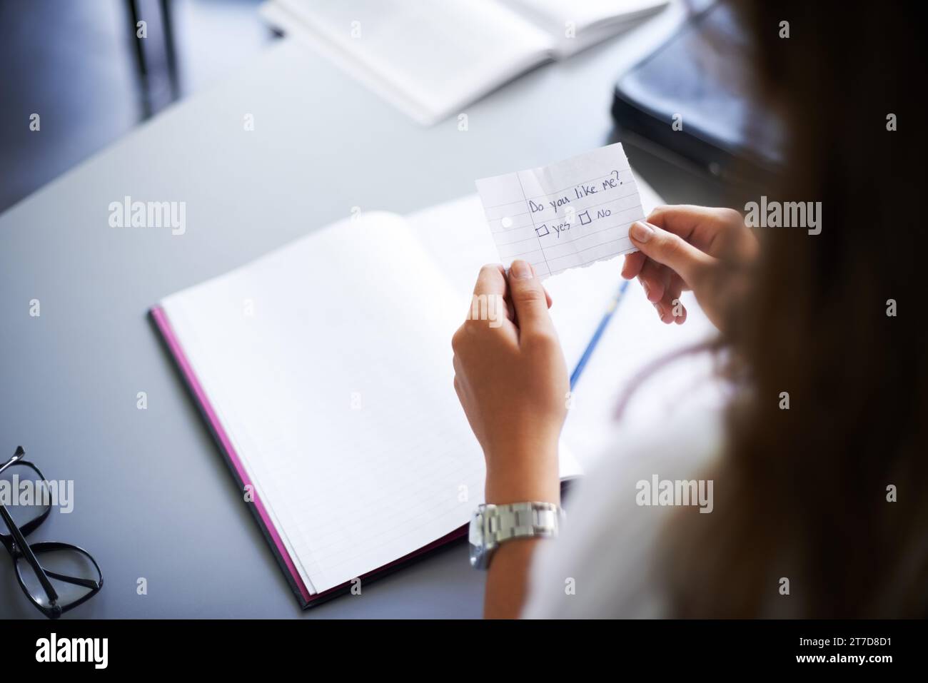 Secret, note and student with love letter in class at high school with ...