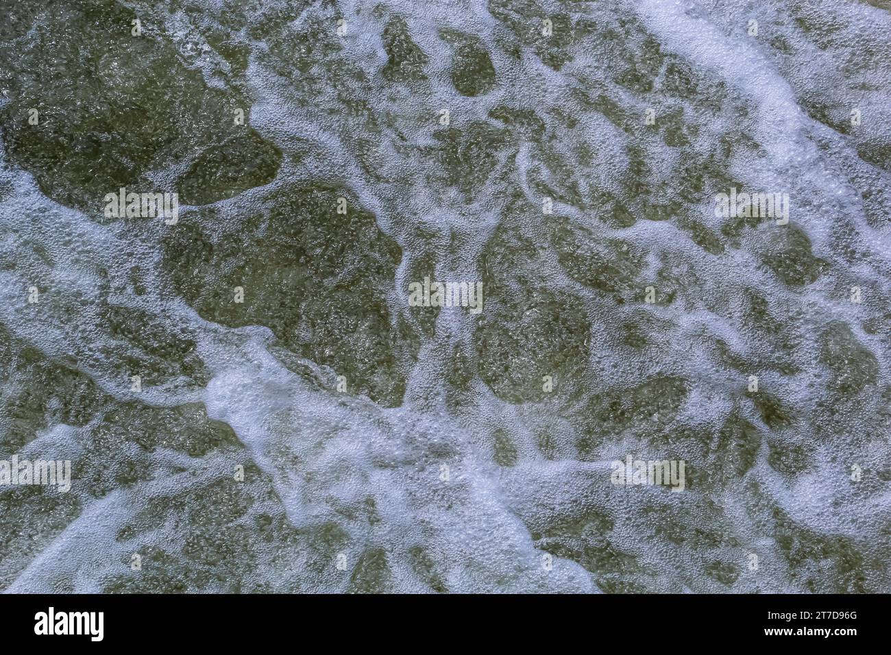 Close up detail of fierce white water river rapids from a clean deep ...