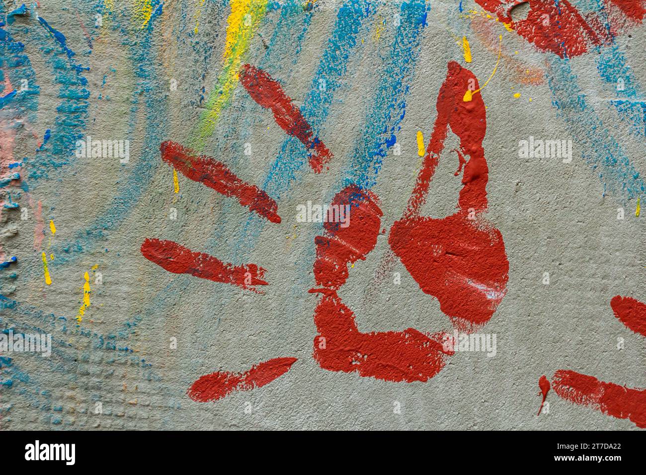 White plastered wall splattered with red paint. Paint splashes on the ...