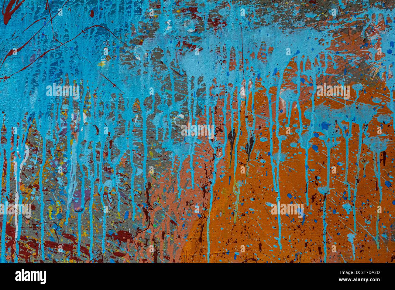 White plastered wall splattered with red paint. Paint splashes on the ...