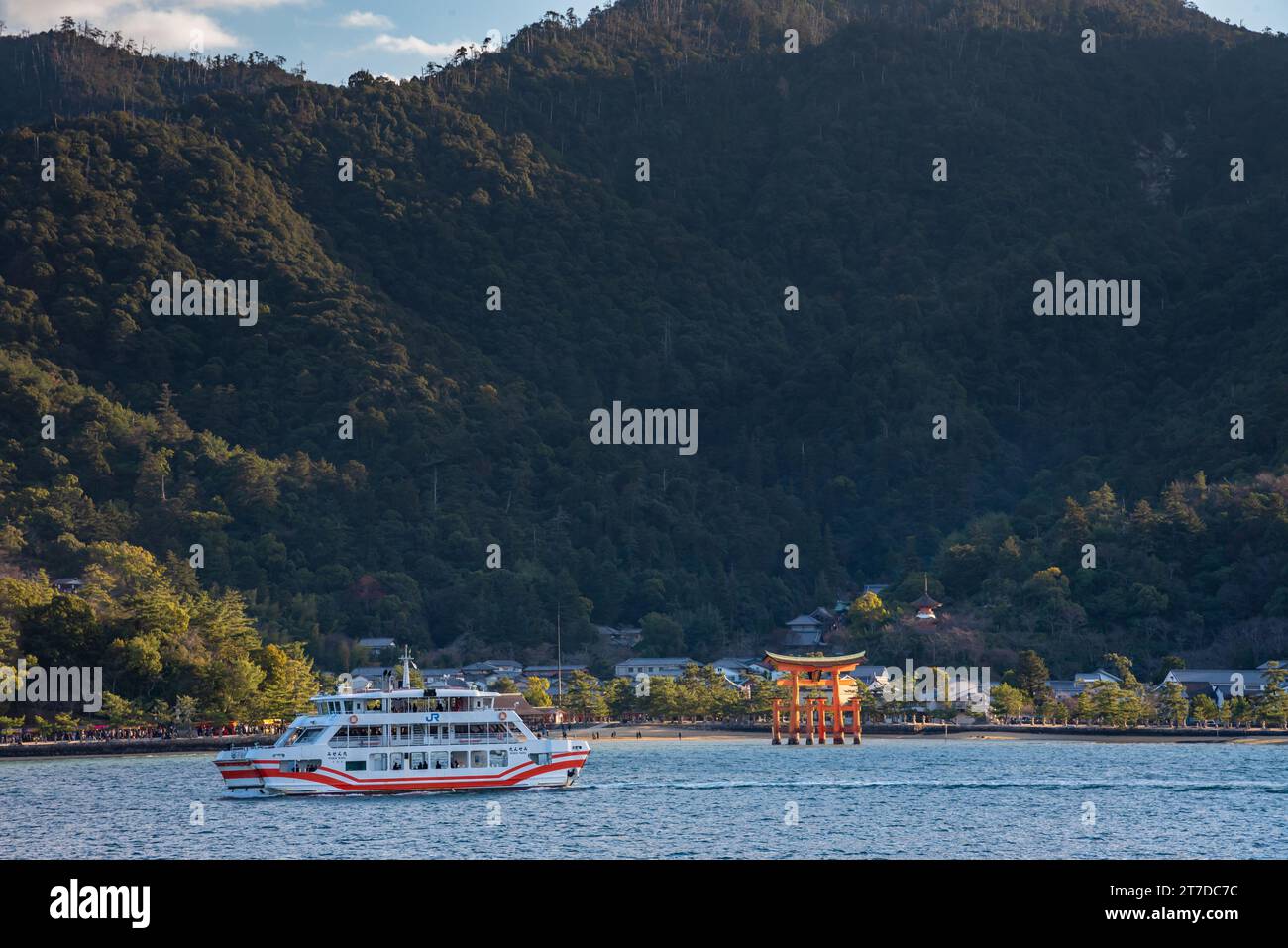 Floating orange red giant Grand O-Torii gate stands in Miyajima island ...