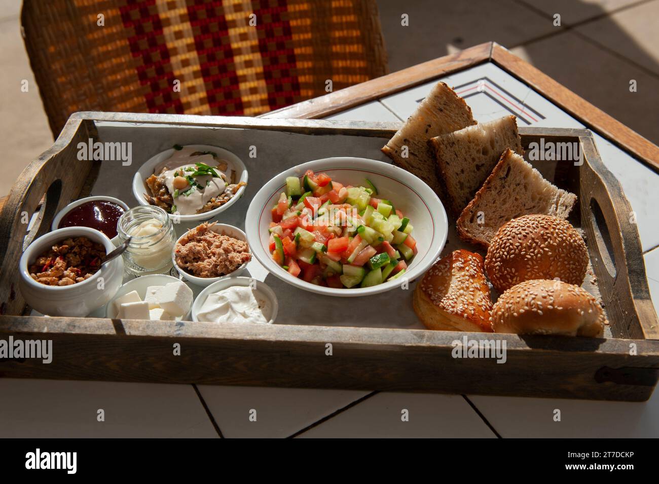 Israeli breakfast featuring Mediterranean salad of cucumbers, tomatoes ...