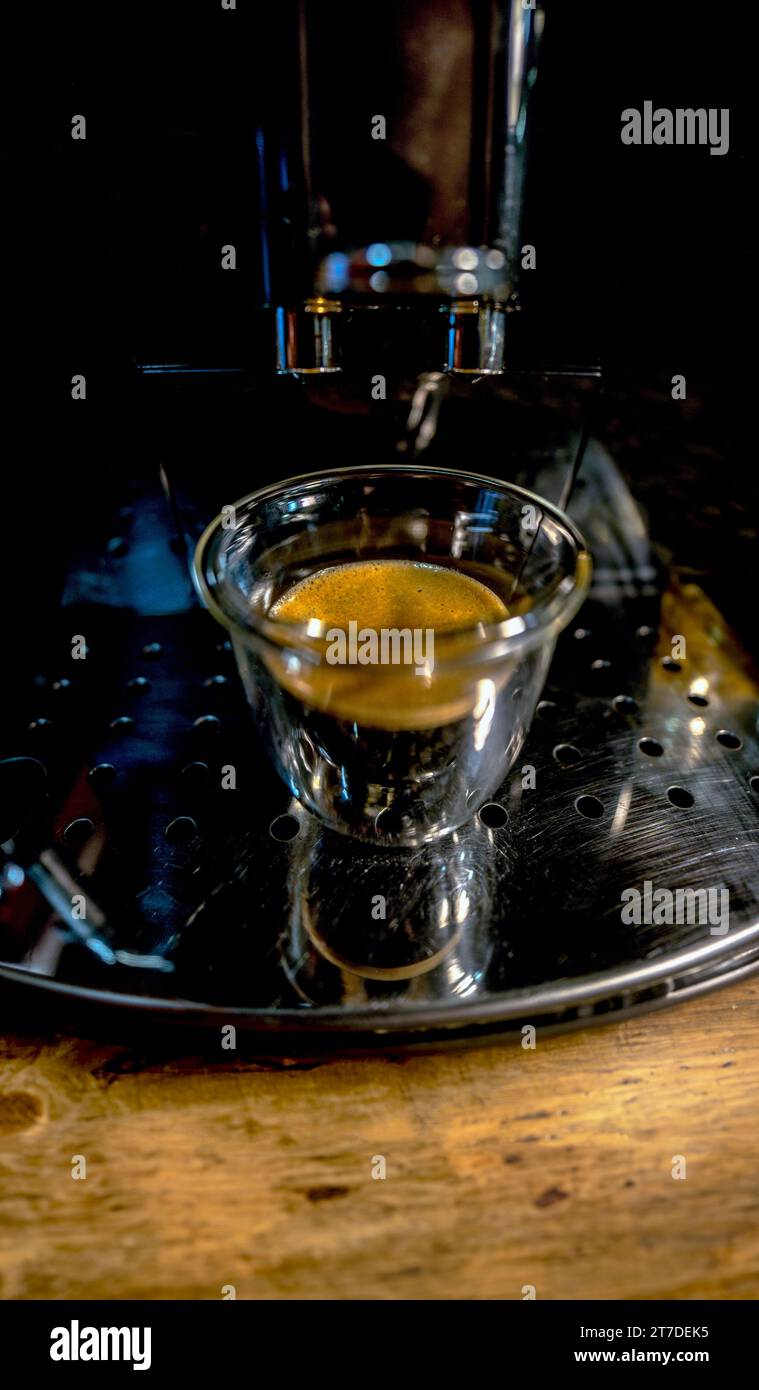 Modern design glass cup of glass with freshly brewed black coffee with ...