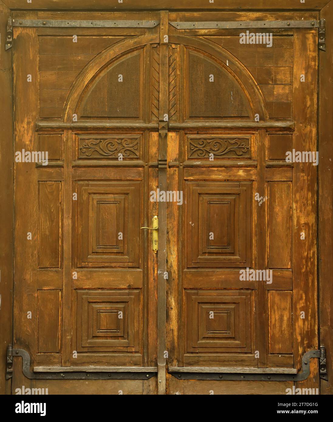 Very old solid wooden door in retro 19th century design close up ...