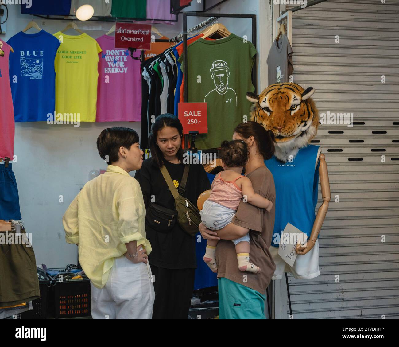 November 11, 2023, Bangkok, Thailand: A shop seller is seen talking ...