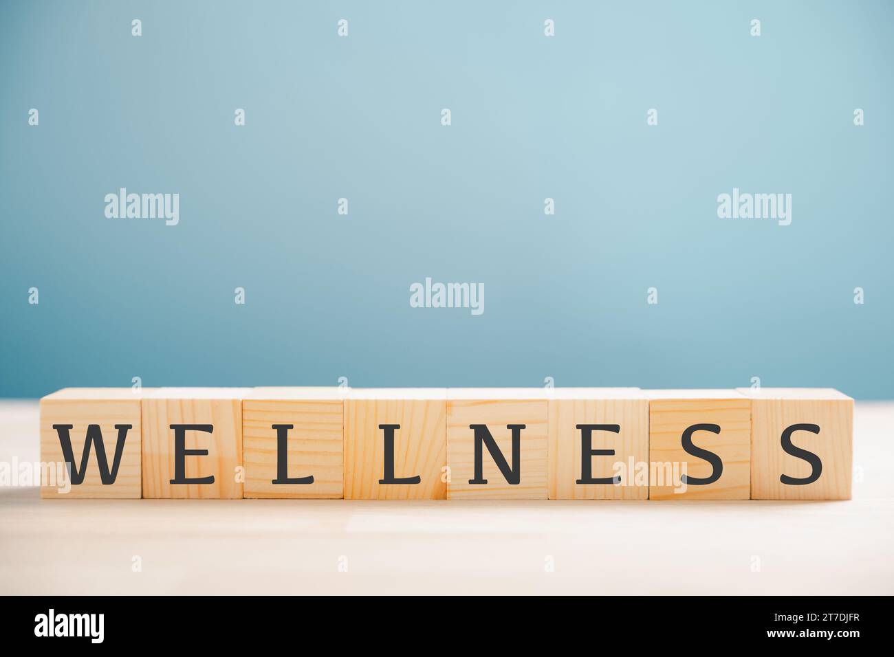 Wooden sign with the word wellness Stock Photo - Alamy