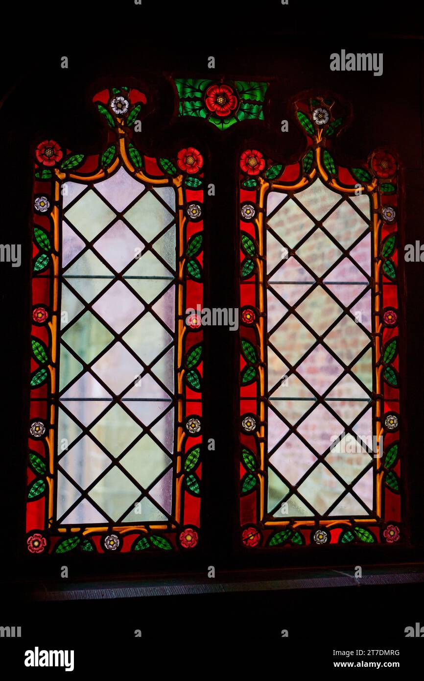 Beautiful colorful medieval stained glass window. Flower motifs Stock ...