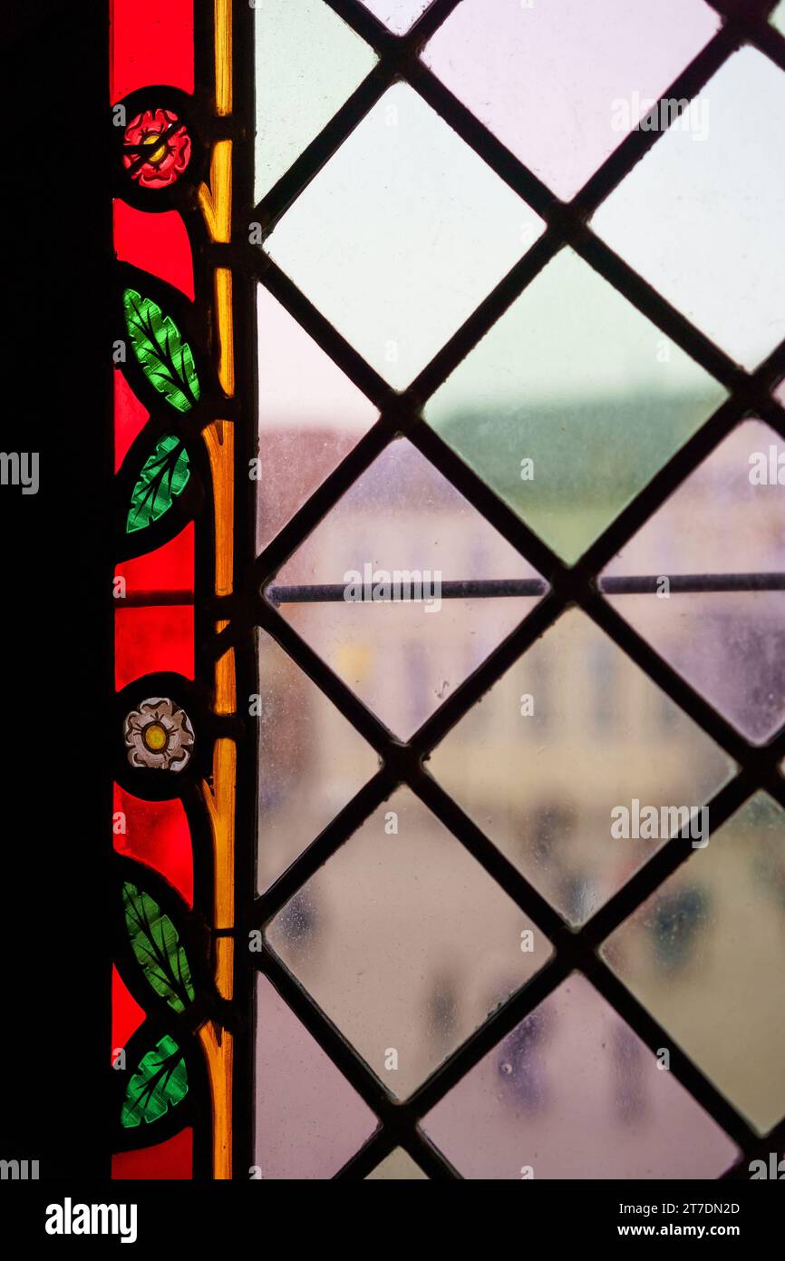 Close up of a beautiful colorful medieval stained glass window. Flower ...