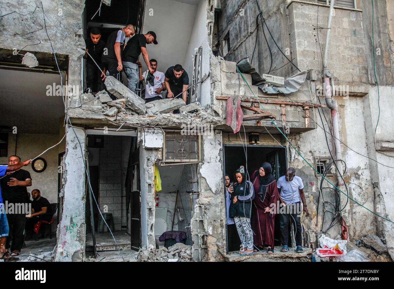 Tulkarm, Palestine. 14th Nov, 2023. Palestinians inspect a damaged ...